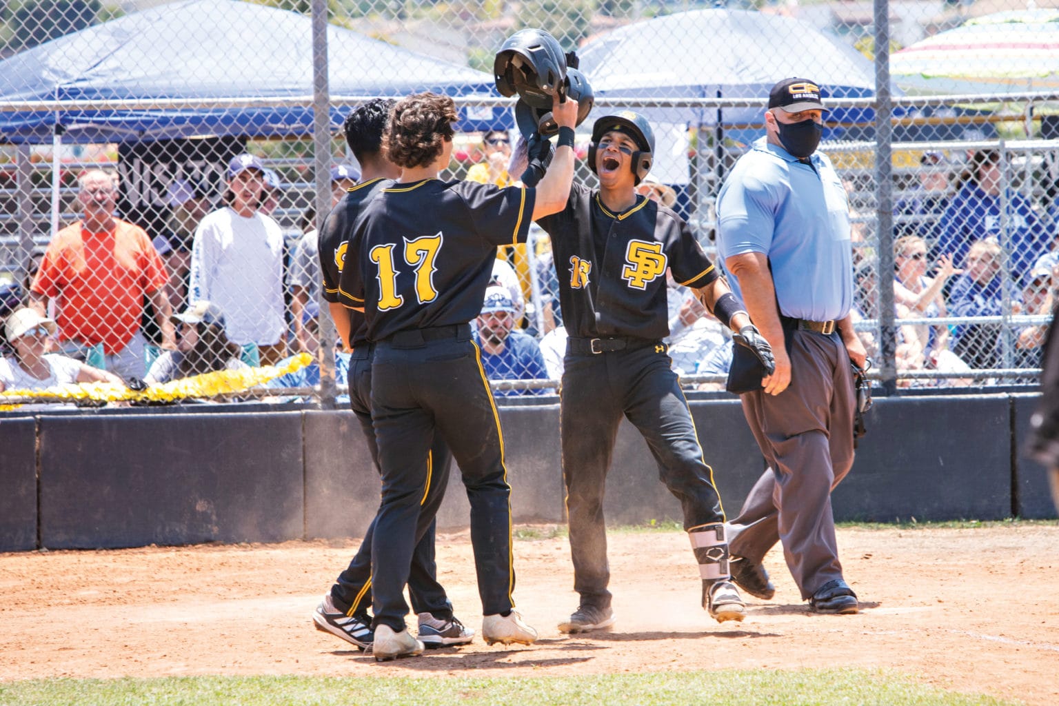 Dominic Porter (right) celebrates his go-ahead home run in the bottom ...
