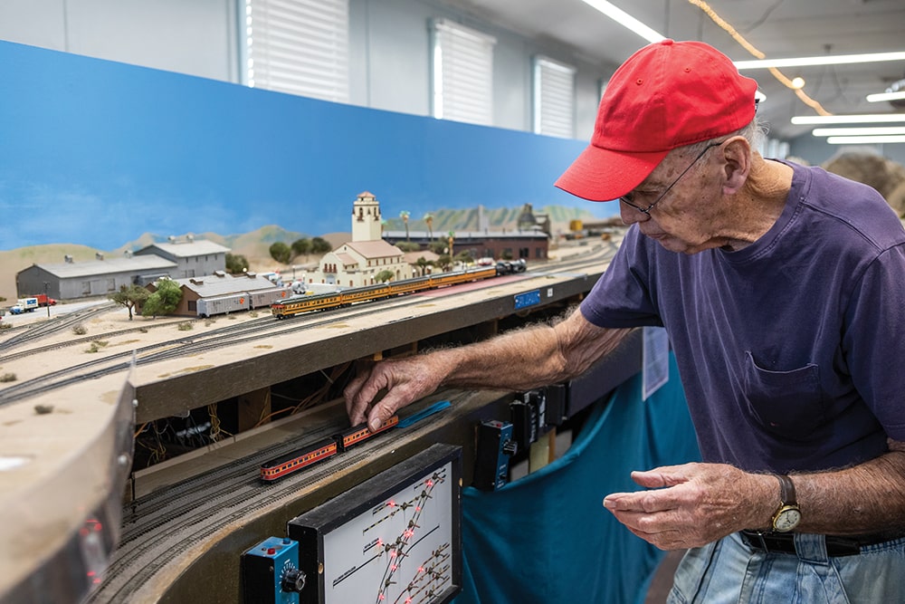 Wilde shows the inner workings of the model railroad set. (photo: John ...