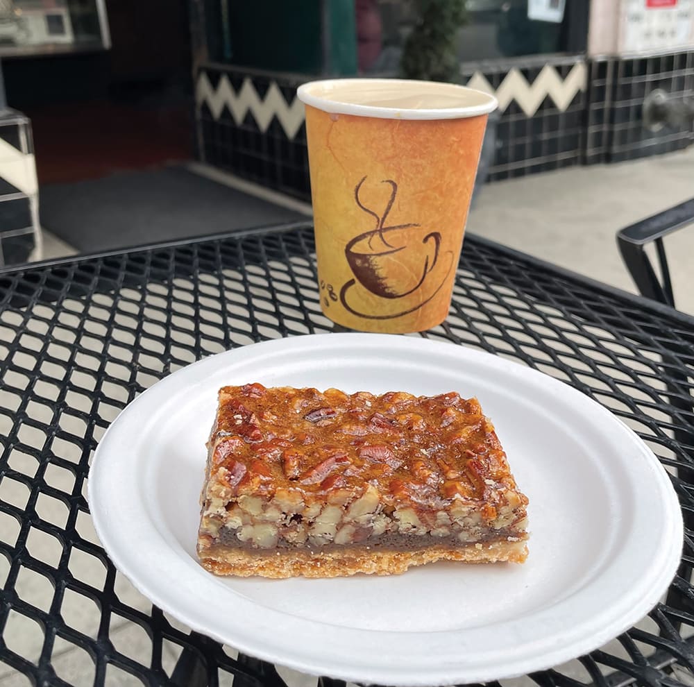 Sacred Grounds’ dirty chai with a pecan bar. (photo: Sanam Lamborn)